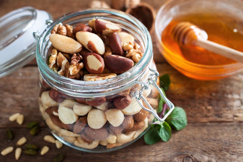 Assorted nuts in glass jar stock photo. Image of group - 75419826
