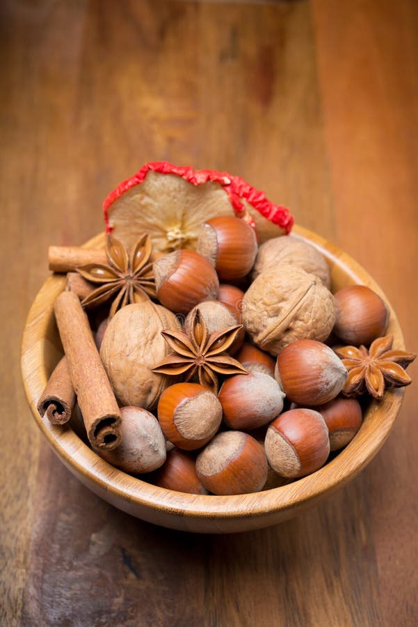 Assorted Nuts and Spices in a Wooden Bowl, Vertical Stock Image - Image ...