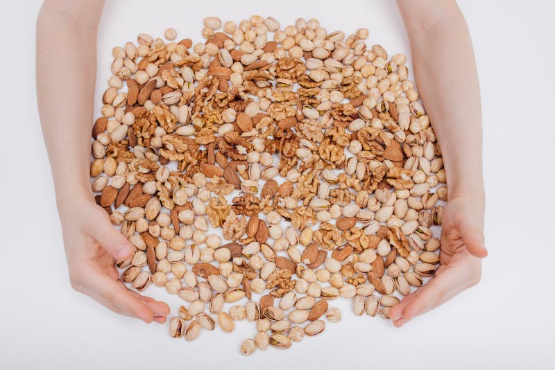 Assorted Nuts Two Hands Walnut Pistachio Almonds Hazelnuts Stock Photos ...
