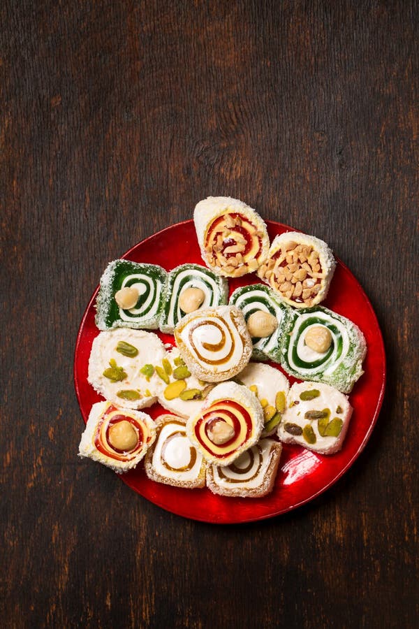 Assorted Oriental Sweets Turkish Delight with Nuts on a Red Plate Stock ...