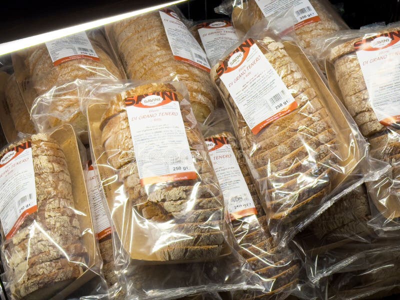 Assorted Packaged Artisan Bread Loaves in Grocery Store Display ...