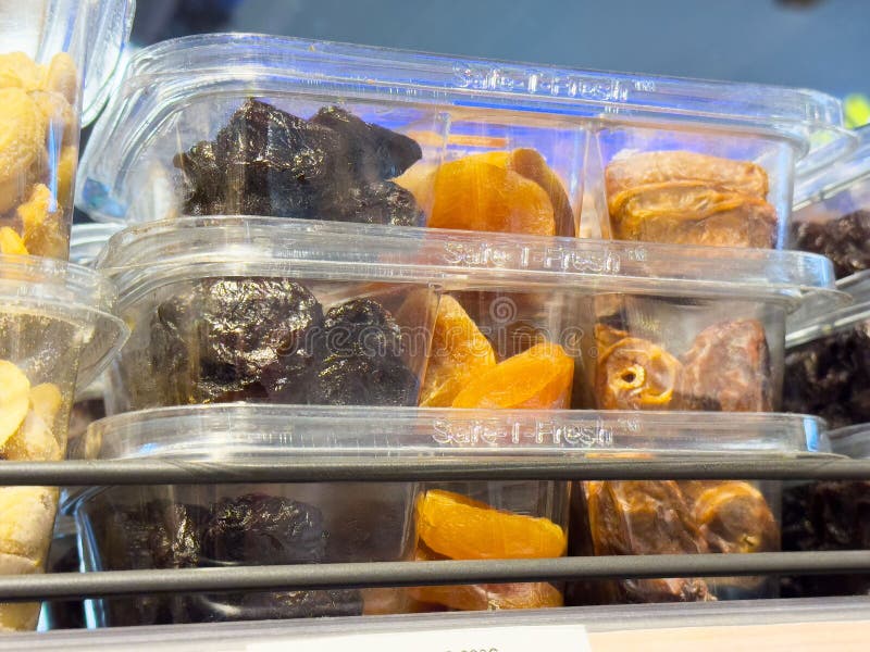 Assorted Packaged Dried Fruits in Plastic Containers on Display Shelf ...