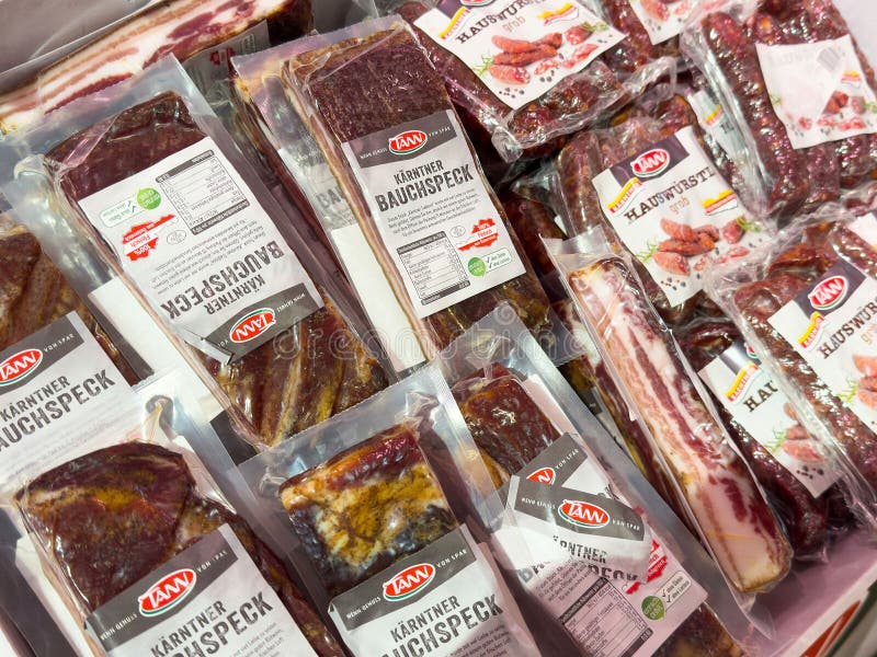 Assorted Packaged Meats Display with Austrian Labeling in Supermarket ...