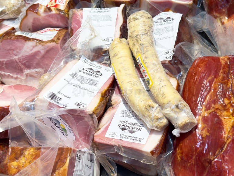 Assorted Packaged Meats and Fresh Horseradish Sticks on Display ...