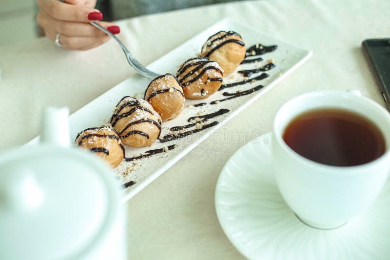 Assorted Pastries on Table with Cup of Tea Stock Image - Image of break ...