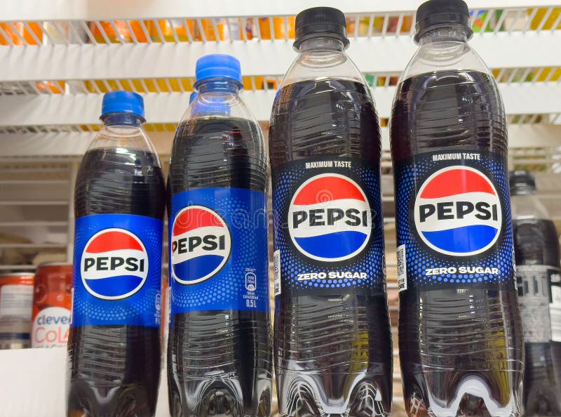 Assorted Pepsi Bottles on Store Shelf: Regular and Zero Sugar Variants ...