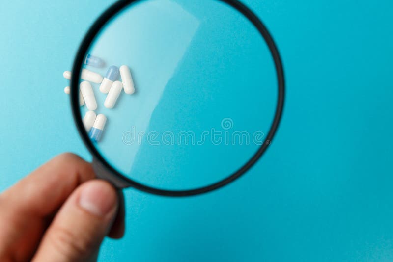 Capsules Under Red Lighting Stock Photo - Image of saturation, orange ...