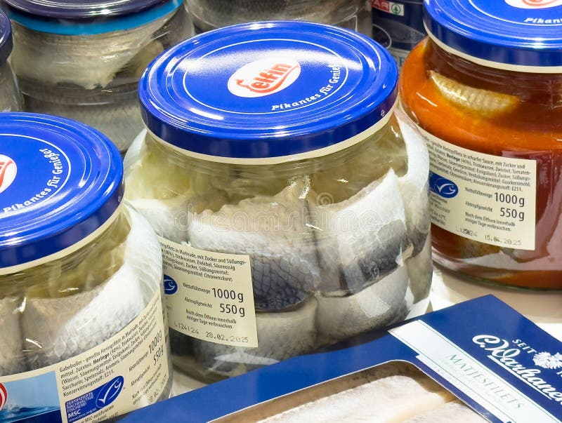 Assorted Pickled Fish Jars with Blue Lids on Display Editorial Image ...