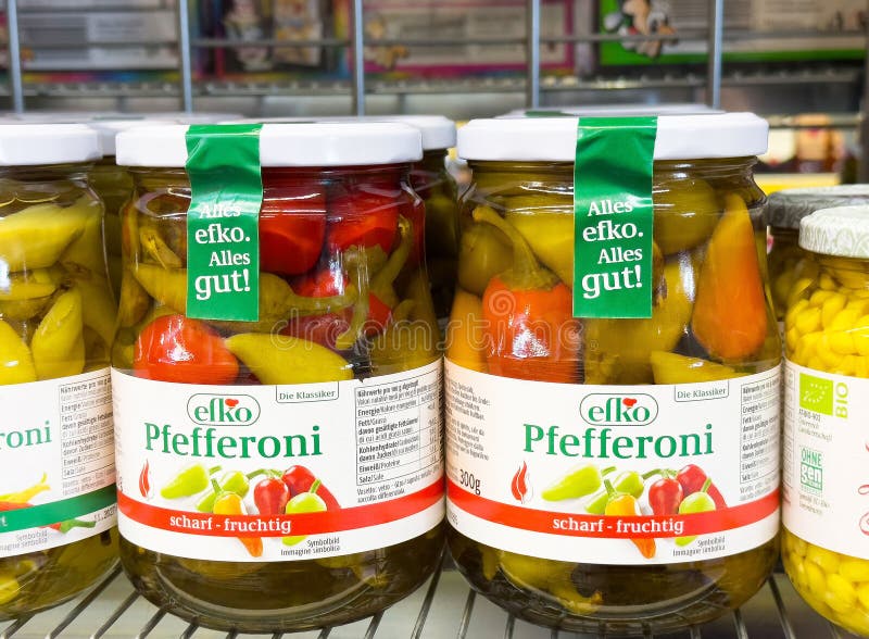 Assorted Pickled Peppers in Jars on Supermarket Shelf with German ...