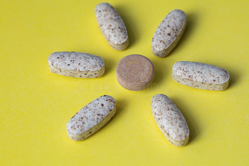 Pills in Form of Flower on Yellow Background Stock Image - Image of ...