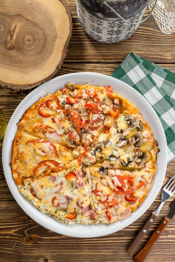 Assorted Pizza Pieces with Ham, Mushroom, Tomato Top View on Wooden ...