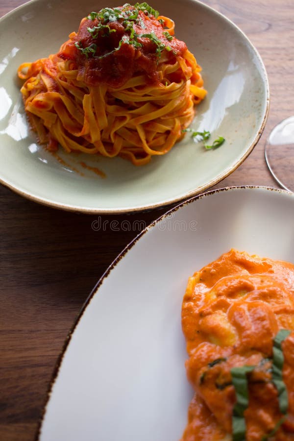 Assorted Plates of Pasta on a Table Stock Photo - Image of leaf, meat ...