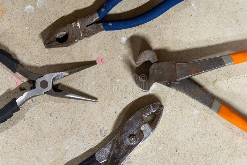 Assorted Pliers on the Ground Stock Photo - Image of grunge, retro ...