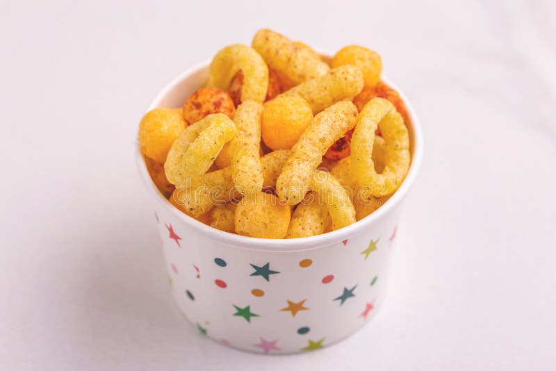 Assorted Puff Corn Snacks in Paper Cup on Light Background Stock Photo ...