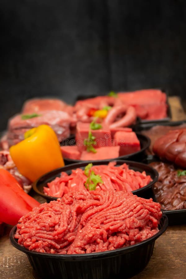 Assorted Raw Beef Meats on Table with Black Background Side View Stock ...