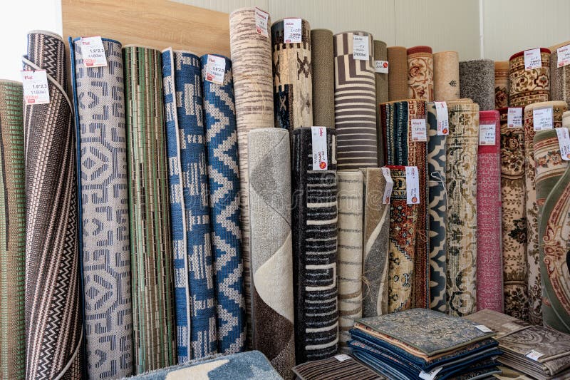 Assorted Rolled Rugs in Carpet Store Display with Various Patterns and ...