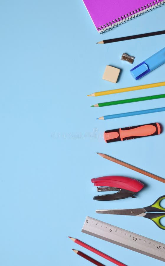 Assorted School Supplies Scattered on the Blue Background Stock Photo ...