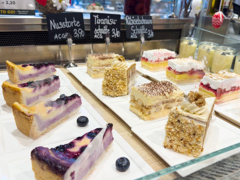 Assorted Slices of Cakes and Pastries on Display in Bakery Editorial ...