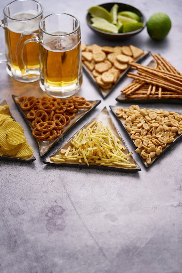 Assorted Snacks with Beer on Table Stock Image - Image of lime, beer ...