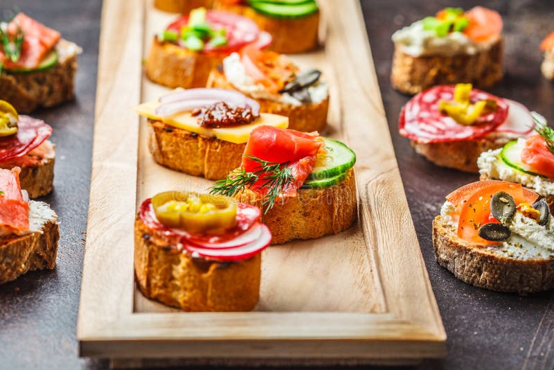 Assorted Spanish Tapas with Fish, Sausage, Cheese and Vegetables. White ...