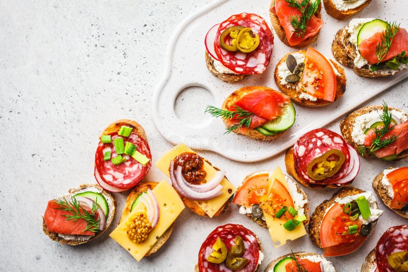 Assorted Spanish Tapas with Fish, Sausage, Cheese and Vegetables. Dark ...