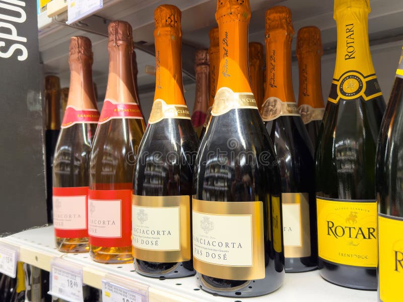 Assorted Sparkling Wine Bottles on Supermarket Shelf with Labels and ...