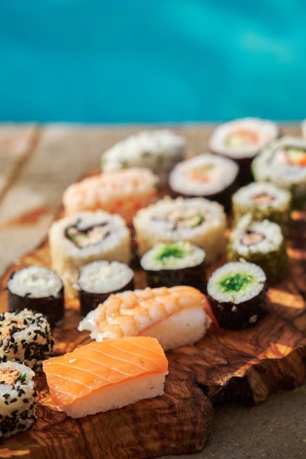 Assorted Sushi on a Board Near the Pool Stock Image - Image of dish ...