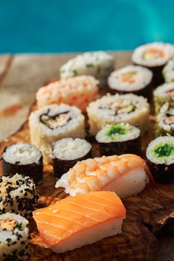 Assorted Sushi on a Board Near the Pool Stock Photo - Image of gourmet ...