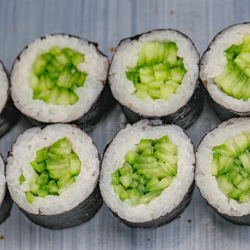 Assorted Sushi Rolls Displayed on Table Stock Image - Image of space ...
