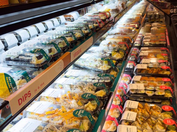 Assorted Sushi and Snacks on Display in Grocery Store Refrigerated ...