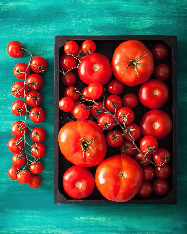 Assorted Tomatoes in Wooden Box Stock Photo - Image of flat, green ...