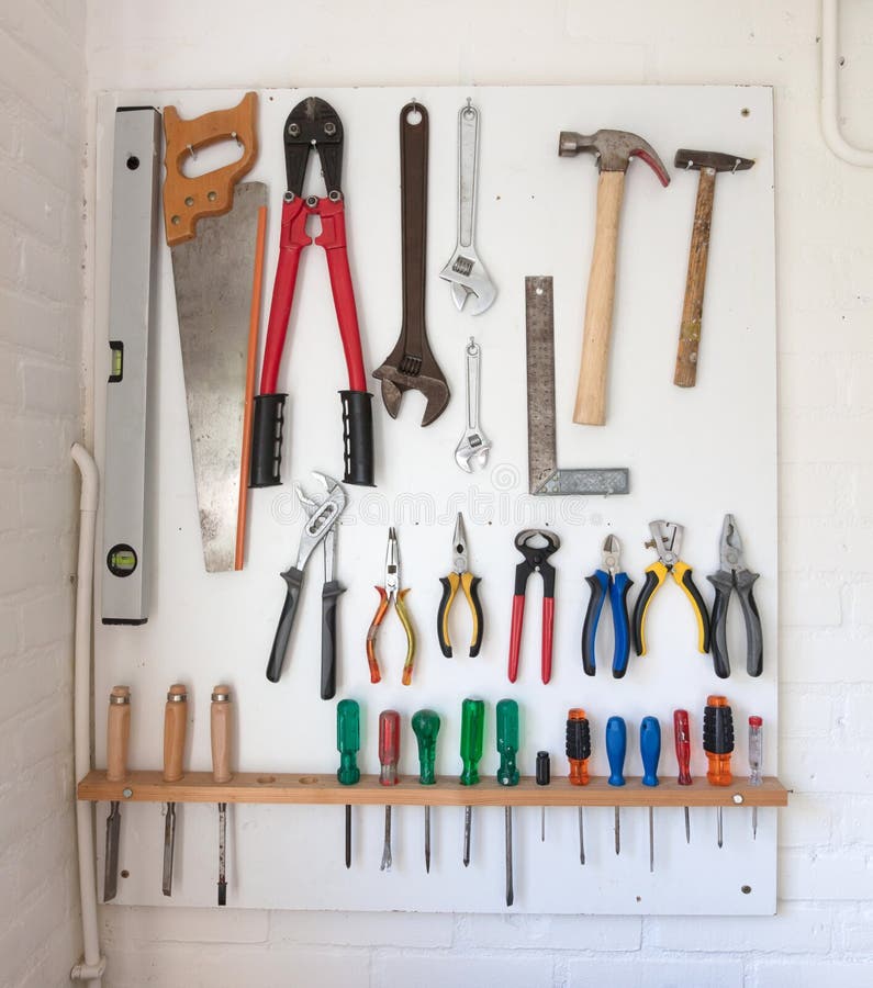 Assorted Tools on a White Tool Board Stock Image - Image of home ...