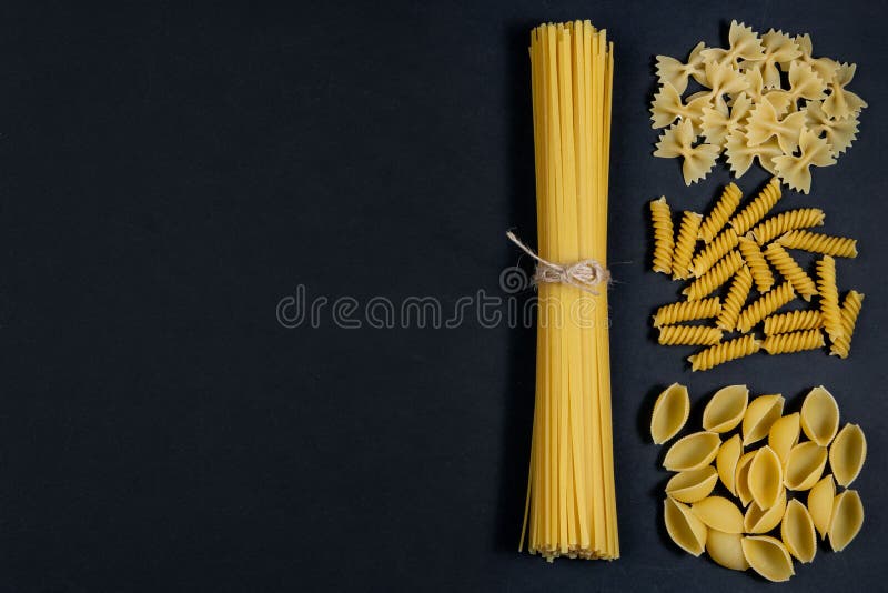 Assorted Types of Pasta on Black Background. Top View. Various Forms of ...