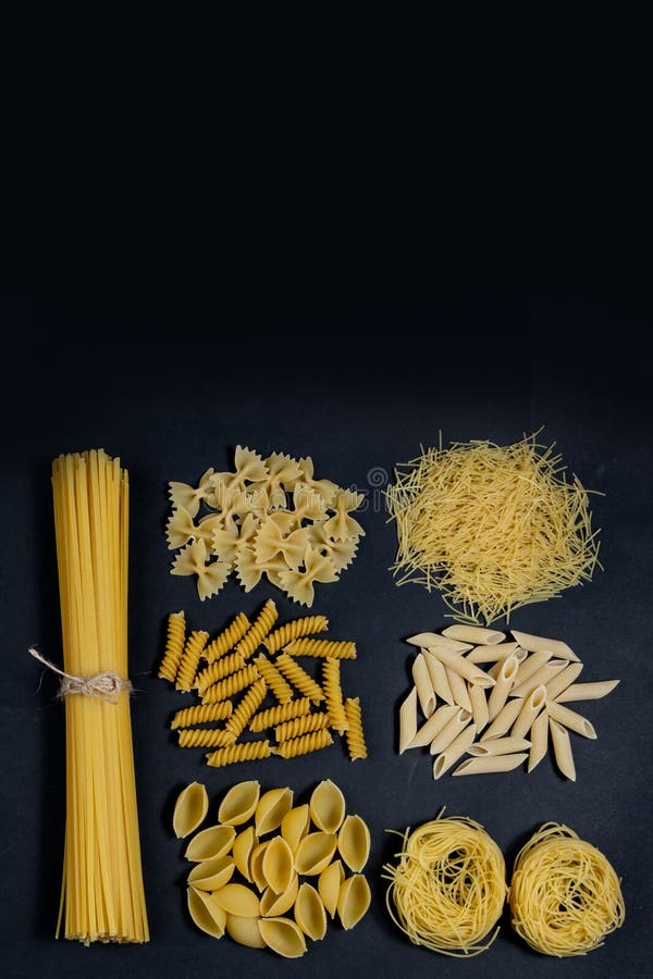 Assorted Types of Pasta on Black Background. Top View. Various Forms of ...