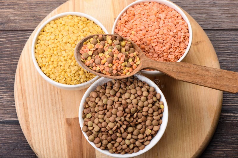 Assorted Varieties of Lentils on a Wooden Background Stock Photo ...