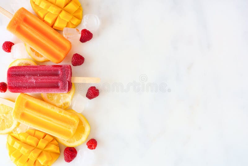 Vibrant Summer Fruit Popsicle Side Border, Top View on a White Marble ...