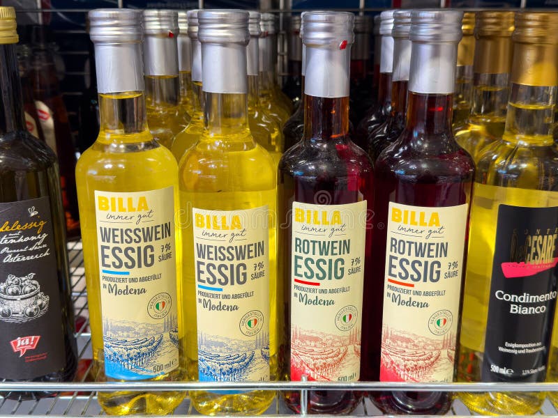 Assorted Vinegar Bottles Display: White and Red Wine Variants on Shelf ...