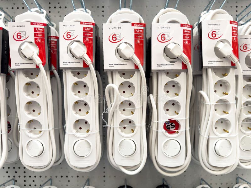 Assorted White Power Strips with Multiple Sockets Hanging on Display ...
