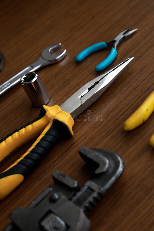 Assorted Yellow Tool Set, Screwdriver, Pliers, Saw Stock Photo - Image ...