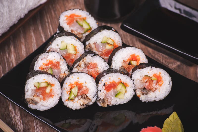 Assorti Fish Sushi Roll on Black Plate Stock Photo - Image of menu ...