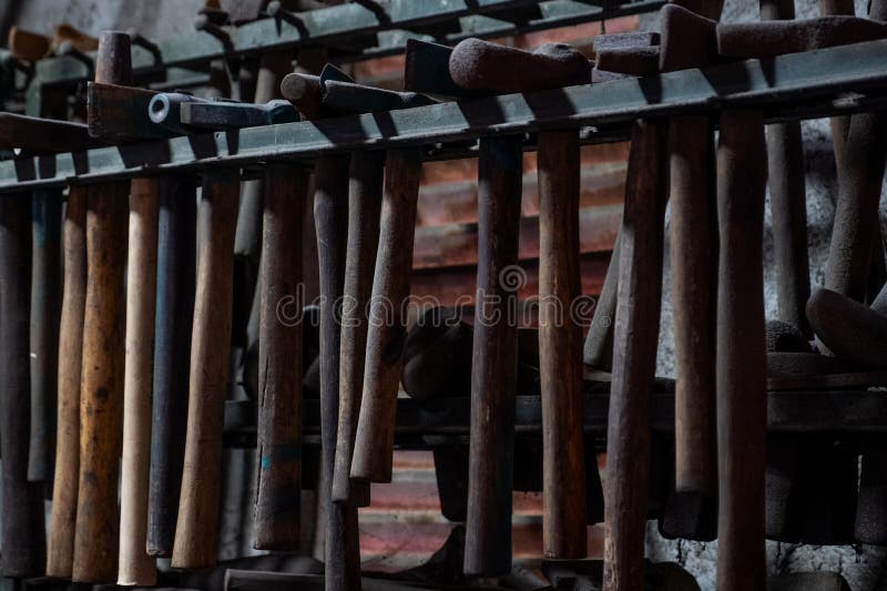 Assortment of Aged Hand Tools with Worn Wooden Handles and Metallic ...
