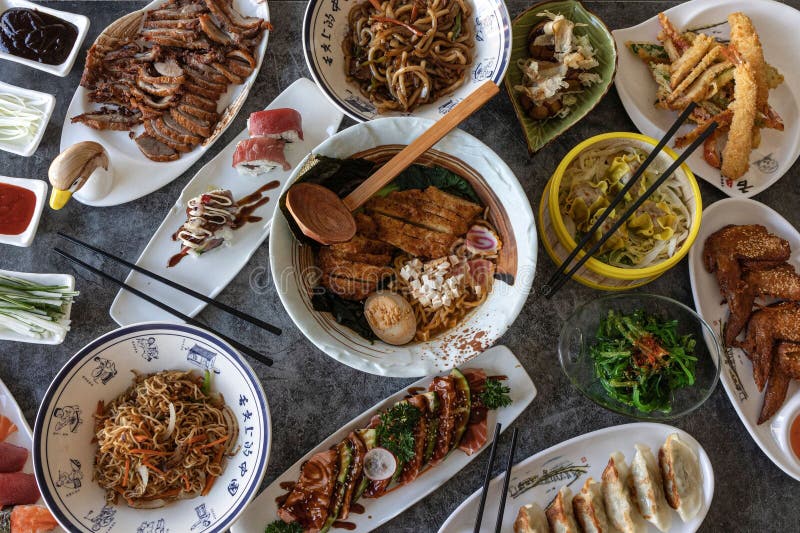 Assortment of Asian Dishes Arranged on a Table Stock Photo - Image of ...