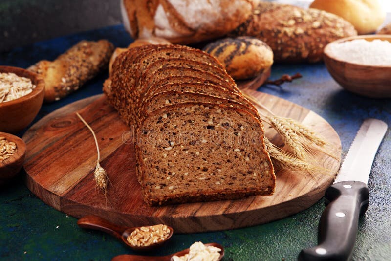 Assortment of Baked Bread and Bread Rolls and Cutted Bread on Table ...