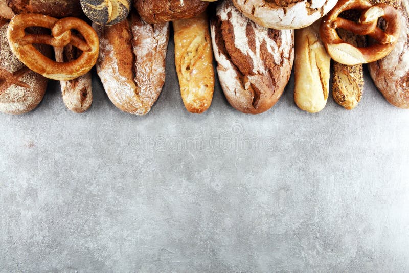 Assortment of Baked Bread and Bread Rolls on Stone Table Background ...