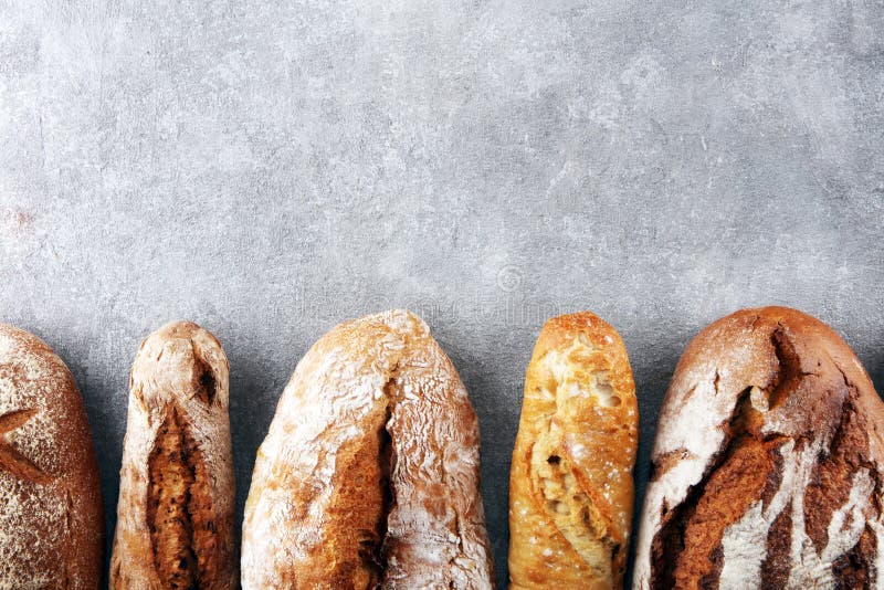 Assortment of Baked Bread and Bread Rolls on Stone Table Background ...