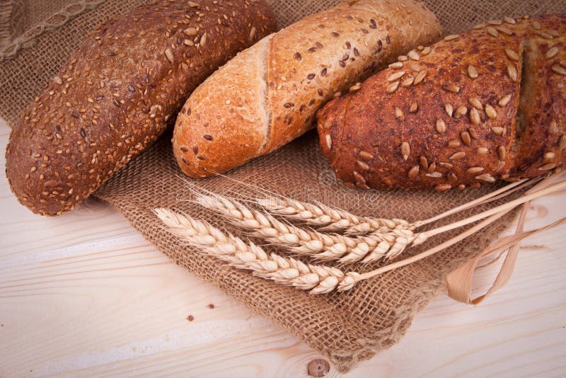 Assortment of Baked Bread on Wood Table Stock Image - Image of ...