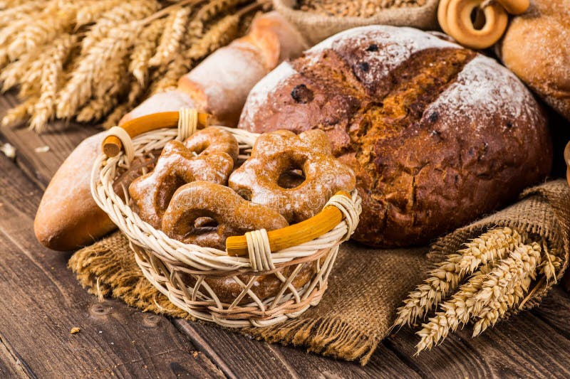 Assortment of Baked Bread on Wood Table Stock Photo - Image of baker ...