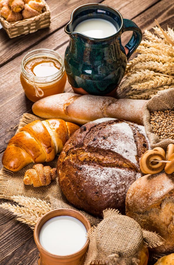 Assortment of Baked Bread on Wood Table Stock Photo - Image of cereal ...