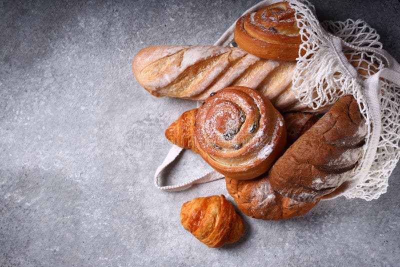Assortment of Bread in a String Bag Stock Image - Image of bread ...