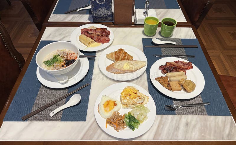 An Assortment of Breakfast Foods and Drinks on a Dining Table Stock ...